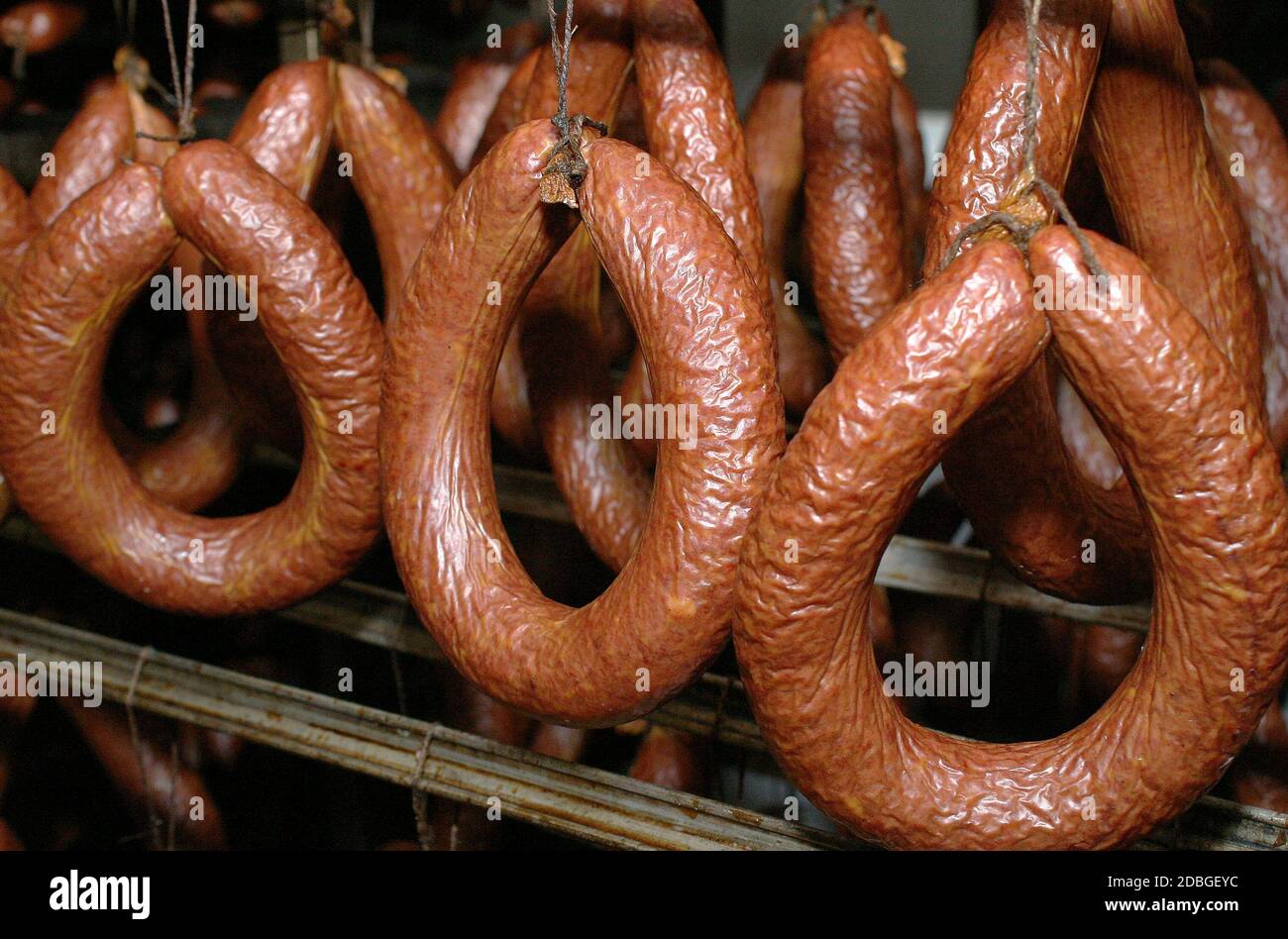 Sausage production line. Sausage on the counter for the smokehouse ...