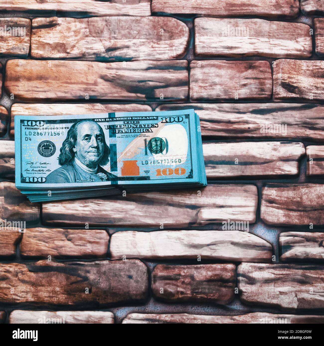 A pack of dollars.A large wad of hundred-dollar bills is lying on a ...