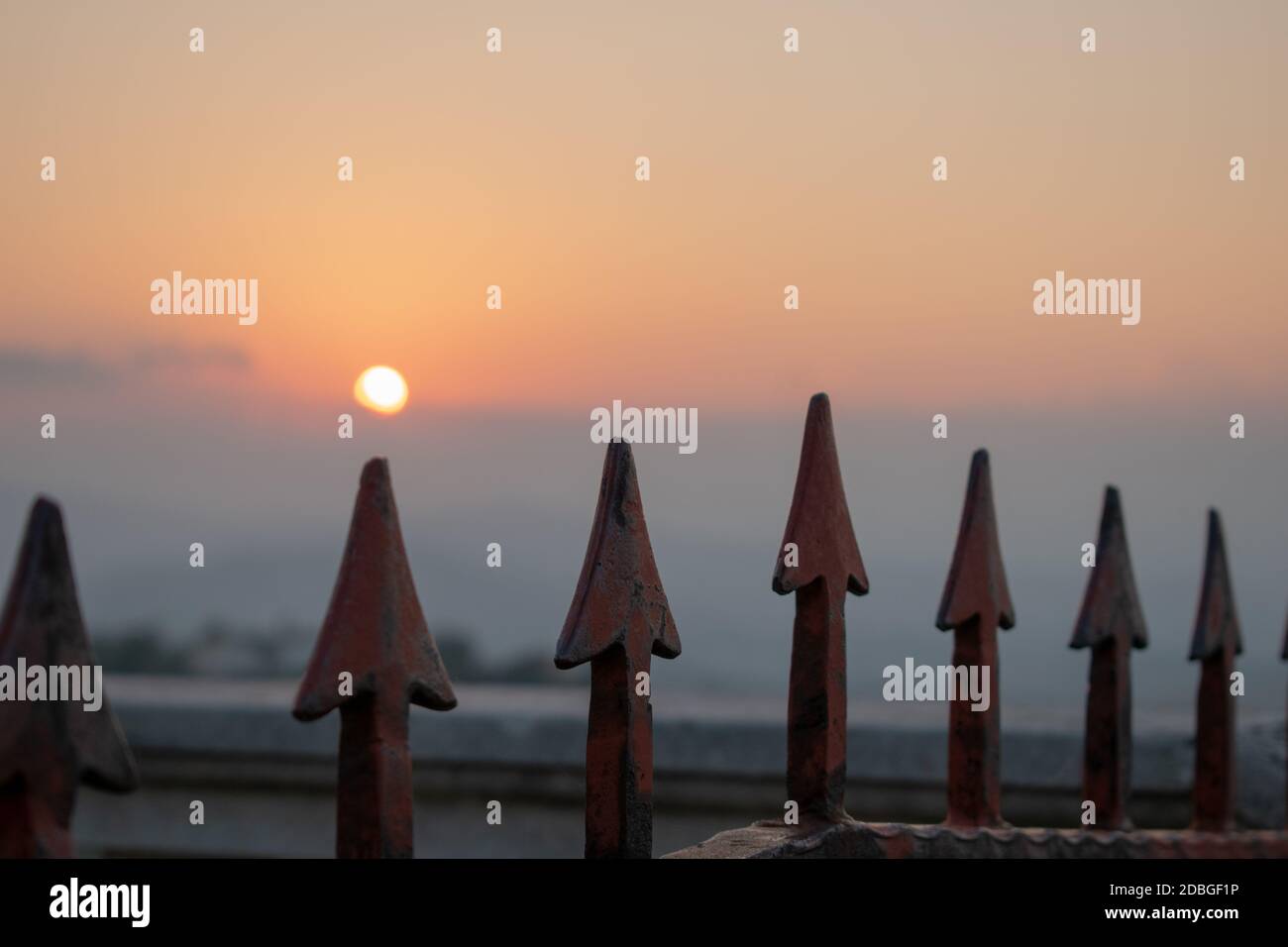 Landscape view of sunset during autumn with mountains and fence and ...