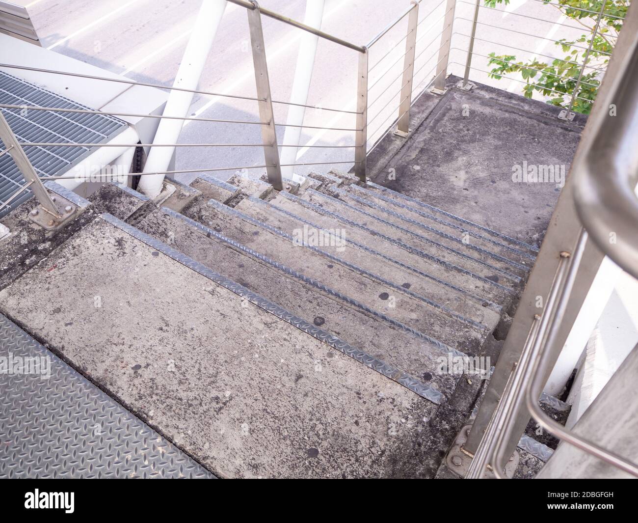 staircase for descending from footbridge. The concrete overpass for ...