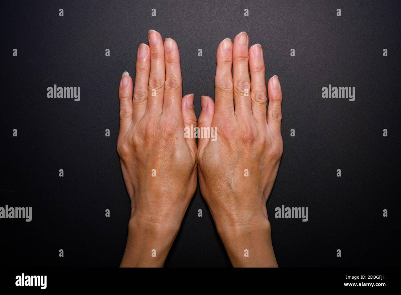 Hand on black background Stock Photo - Alamy