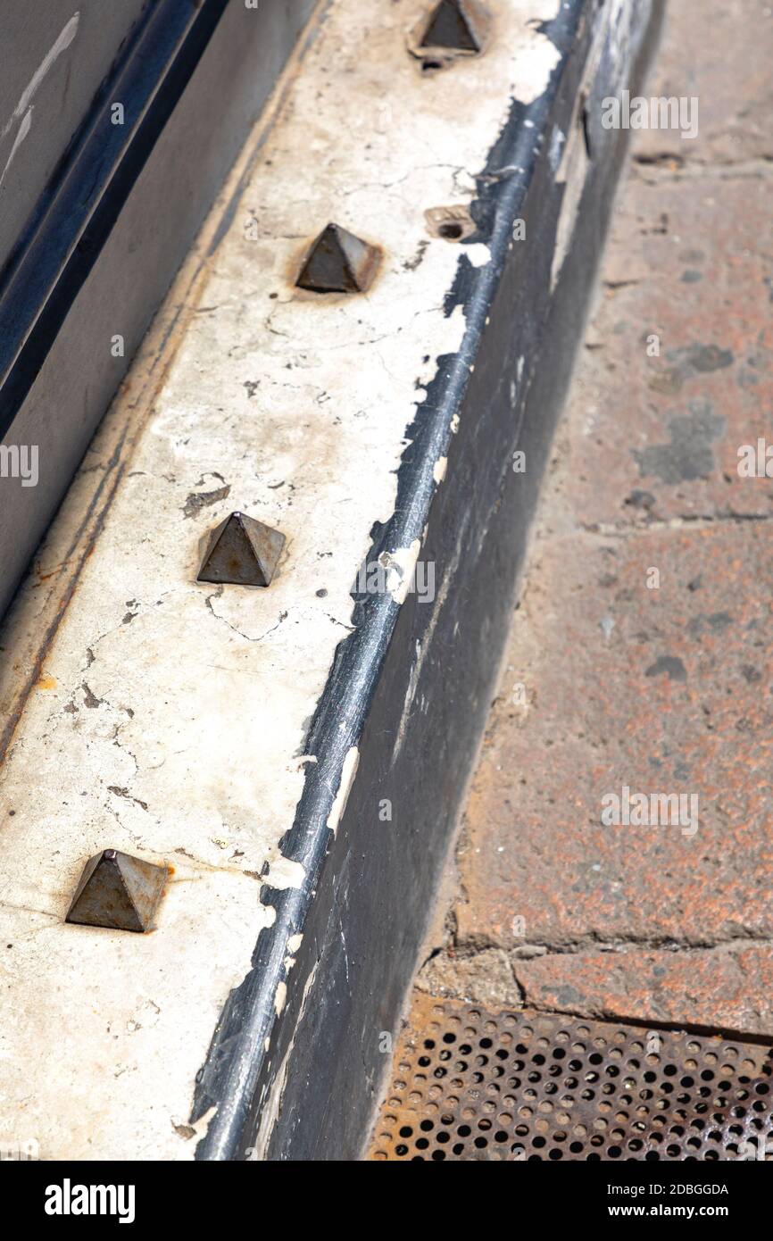 Metal Spikes Anti Homeless Device in Front of Building Stock Photo - Alamy