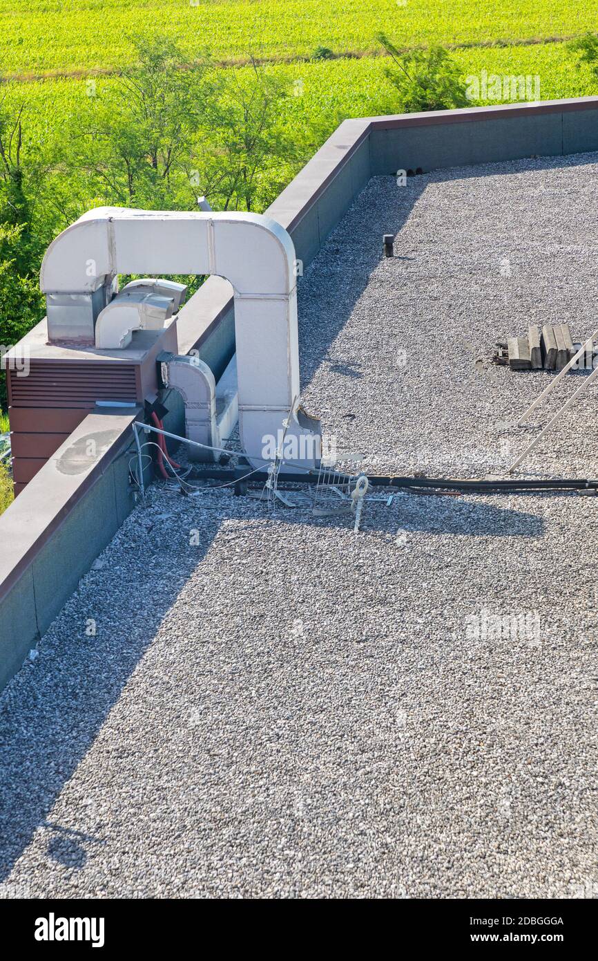 Air Duct Hvac at Gravel Flat Roof Hall Building Stock Photo - Alamy