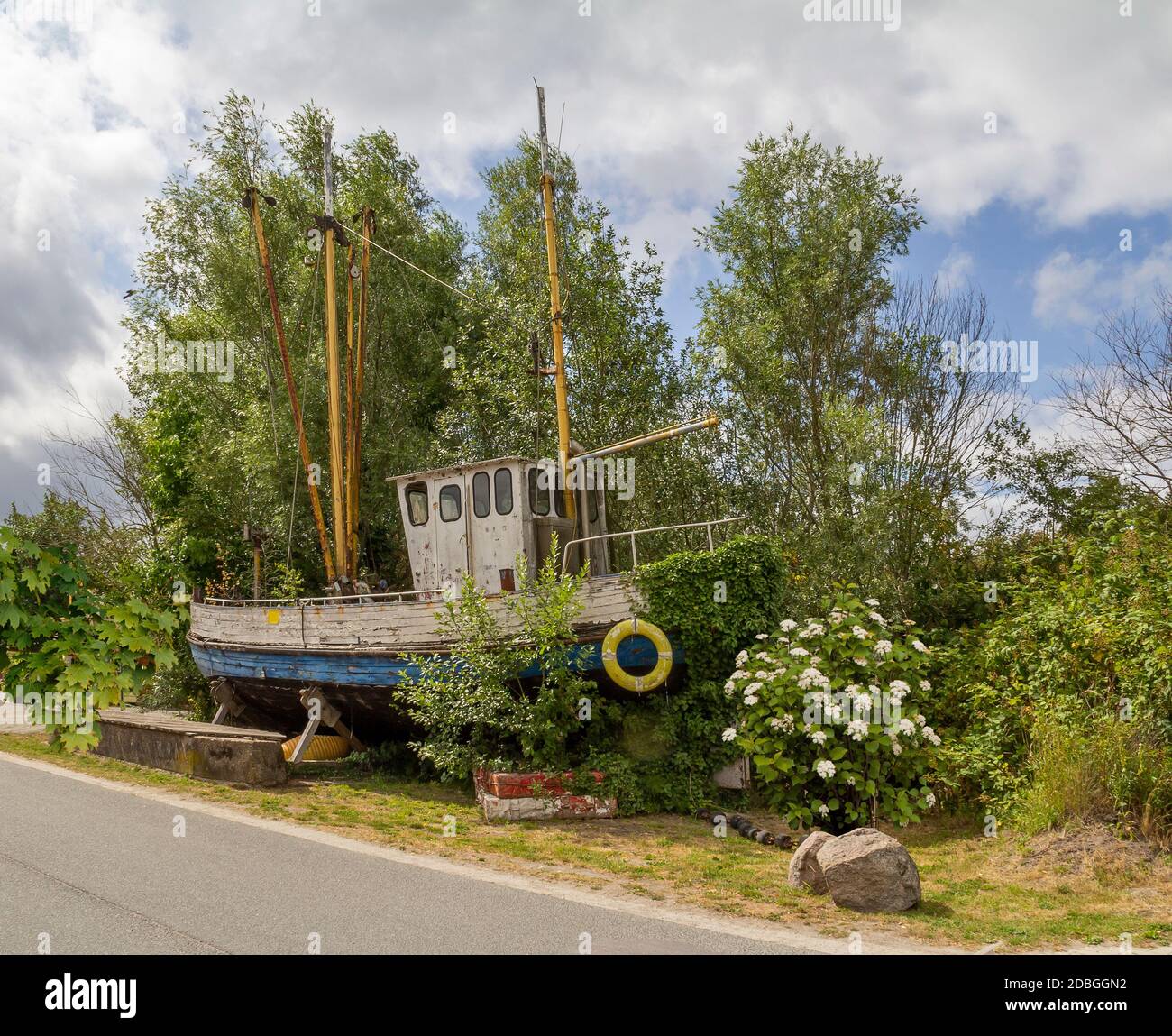 roadside scenery showing a rundown fishing cutter seen at Varel in East ...