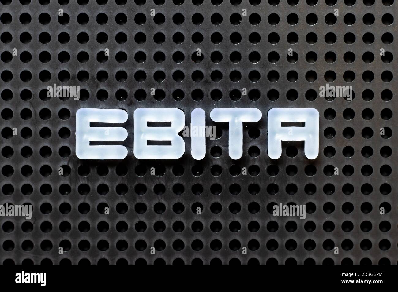White color alphabet with word EBITA (abbreviation of earnings before ...
