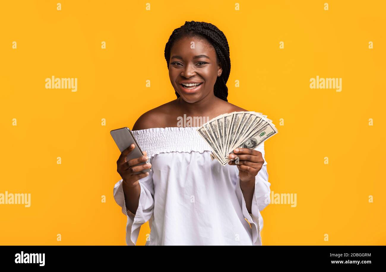 Lady holding cash hi-res stock photography and images - Alamy