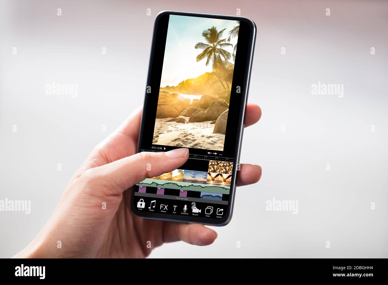 Editing Videos On Mobile Phone Using Video Editor App Stock Photo - Alamy