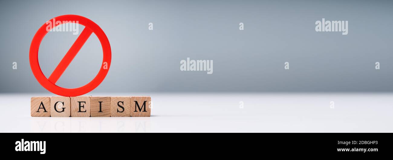 Stop Social Ageism At Desk. Discriminated Generations Stock Photo - Alamy