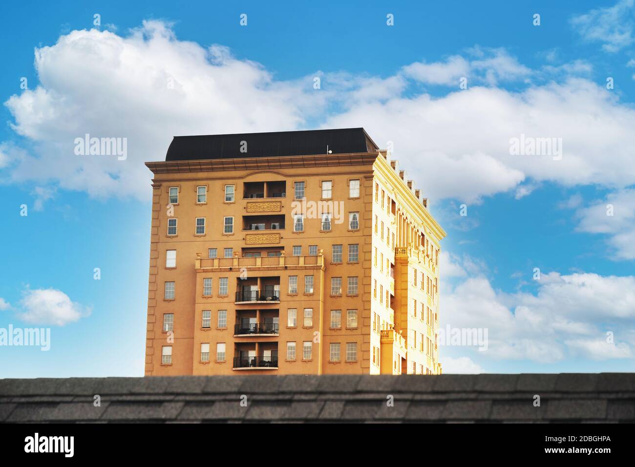 BIG BIRD: A tall yellow building in Denver towers high up beyond the ...