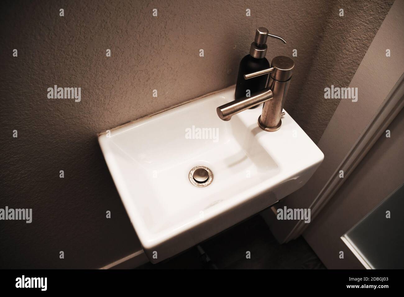 BATH HOUSE: A first person perspective of a bathroom sink seen from the ...