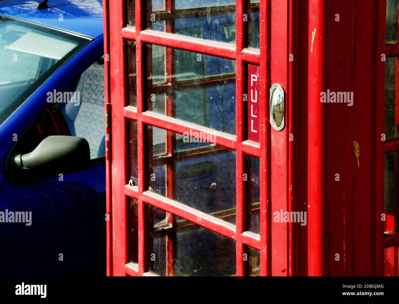 Blue car parked next to a telephone box in Penarth, Wales Stock Photo ...