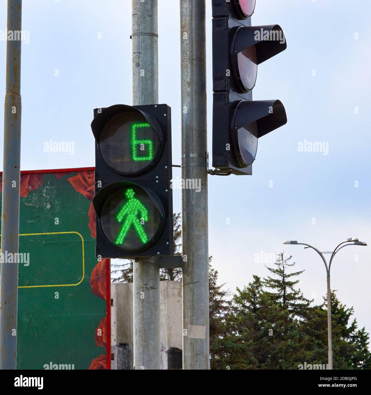 traffic light with green light on a pole, count the seconds until the ...
