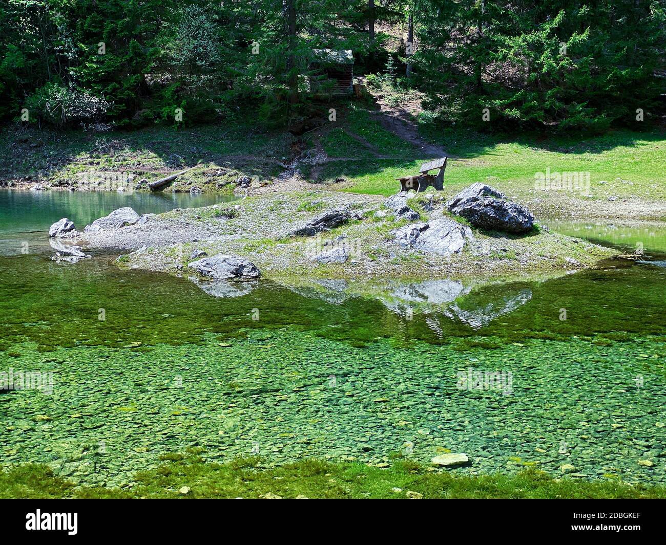 Bench At Green Lake Austria, melting water in the mountains Stock Photo ...