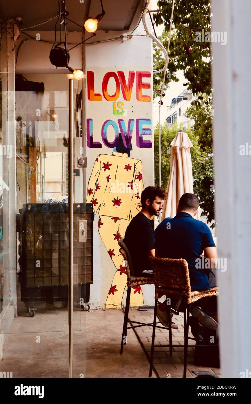 a two guys are resting in a cafe Stock Photo - Alamy