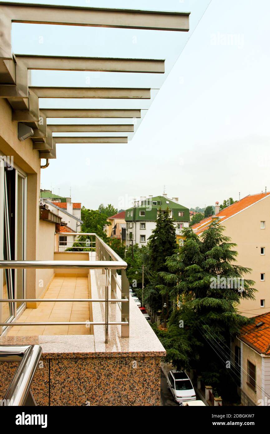 Side view of last floor balcony terrace Stock Photo - Alamy