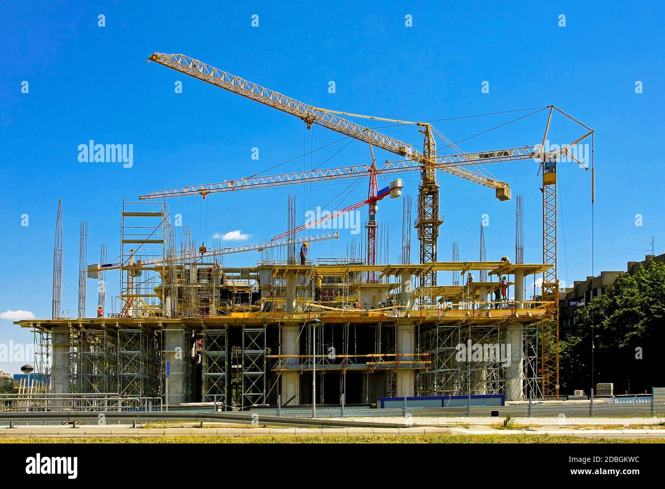 Big building construction site with several cranes Stock Photo - Alamy