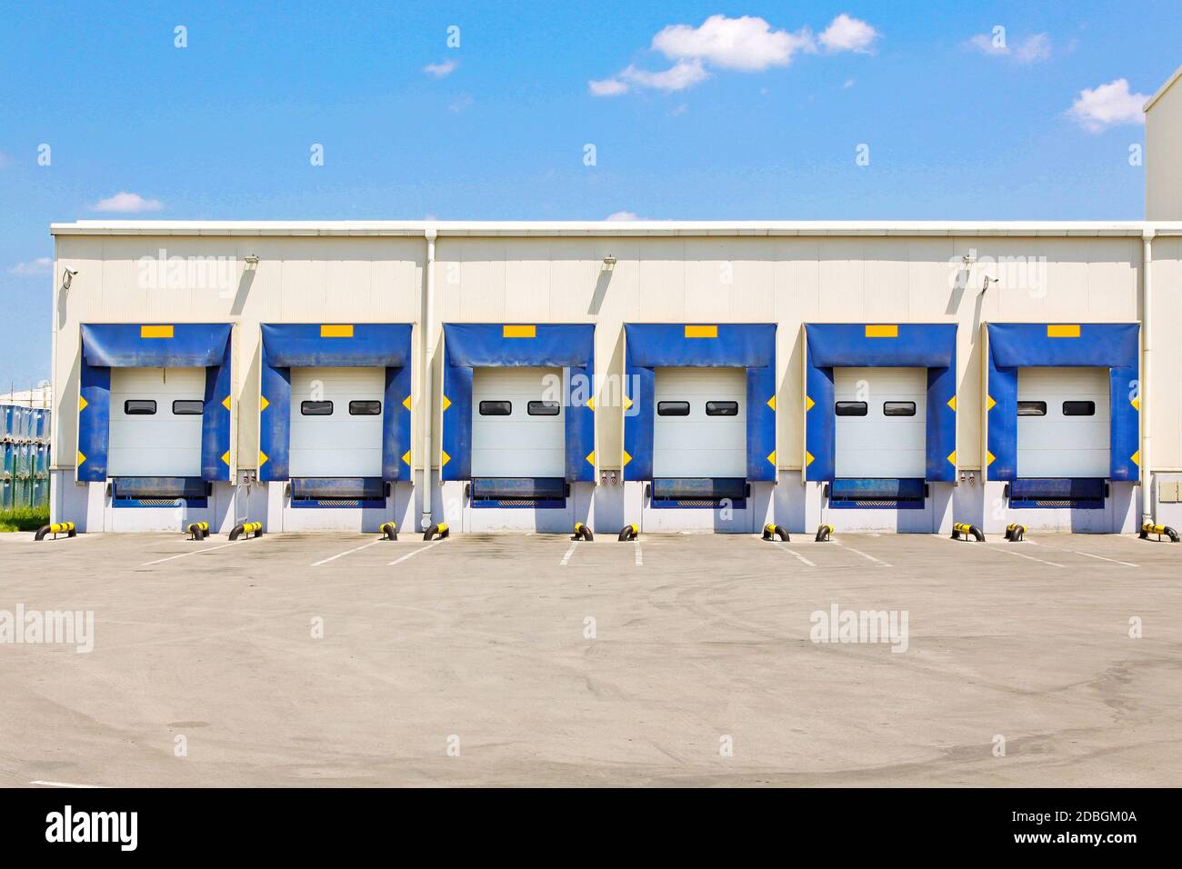 Front view of big warehouse loading dock Stock Photo - Alamy
