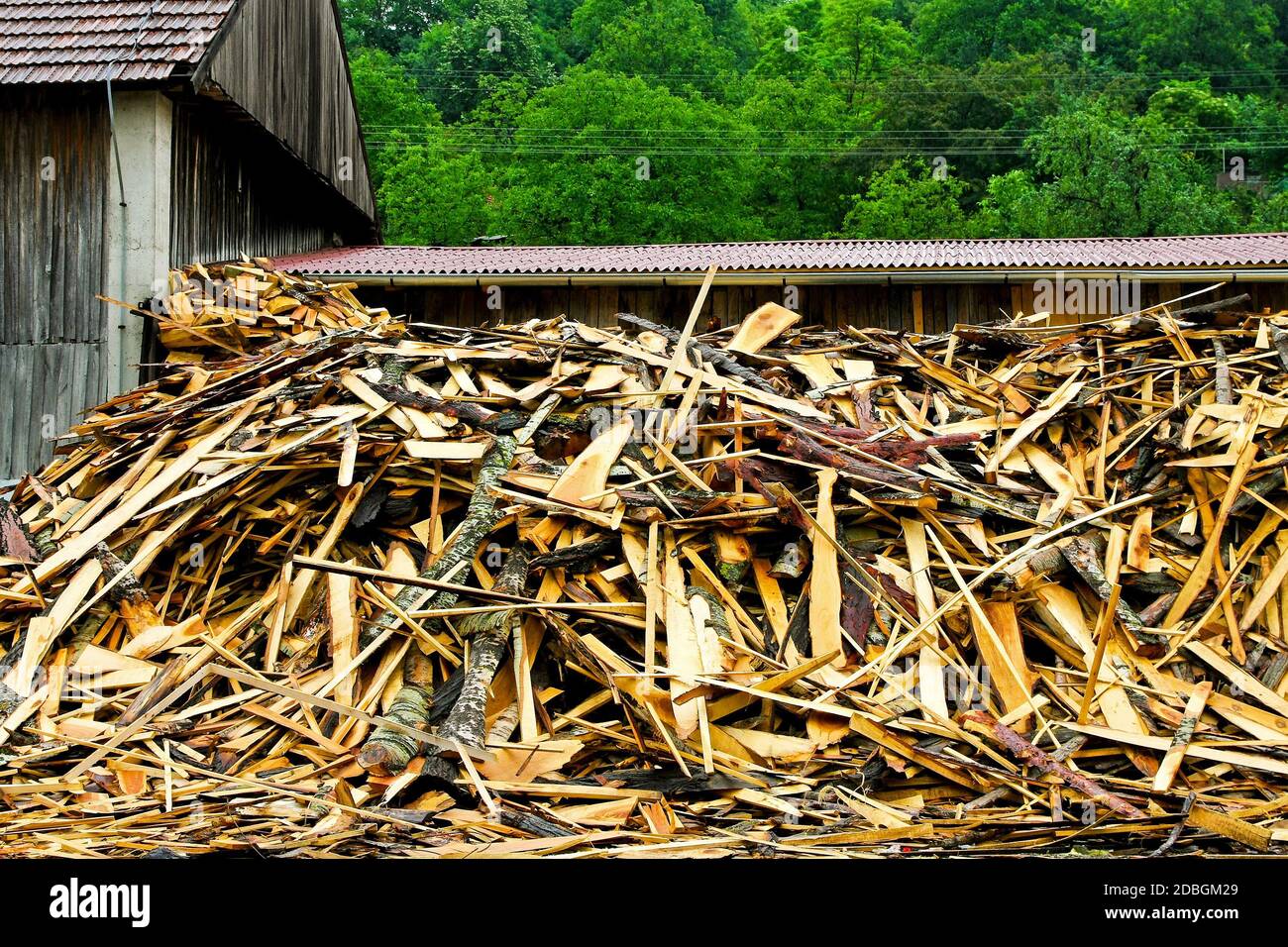 Big pile of timber wood in front of factory Stock Photo - Alamy