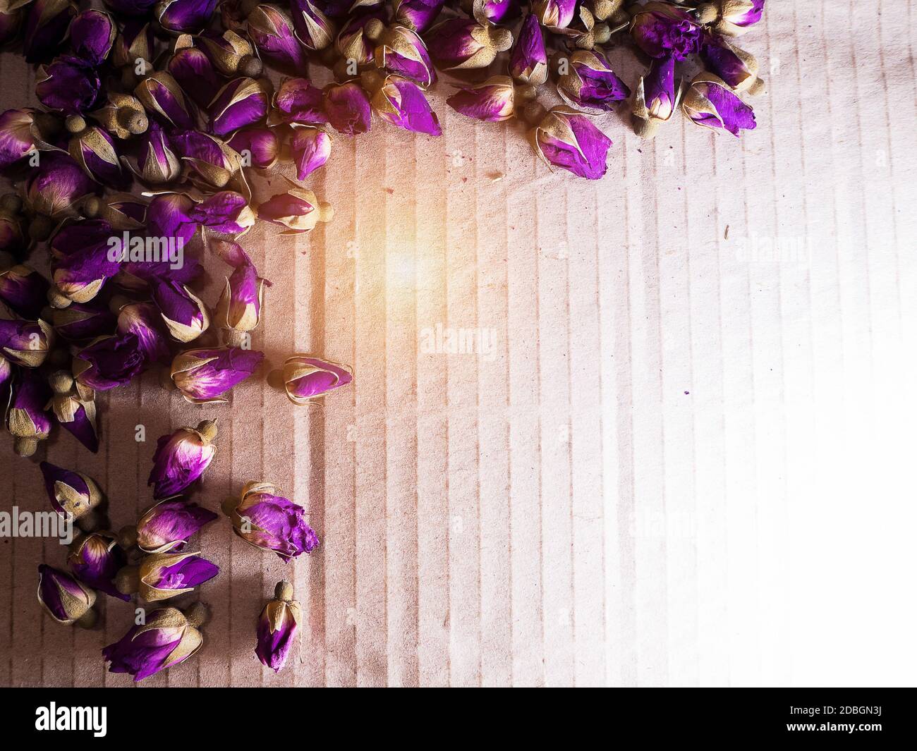 The dried roses plenty on brown background with wooden spoon,vintage ...