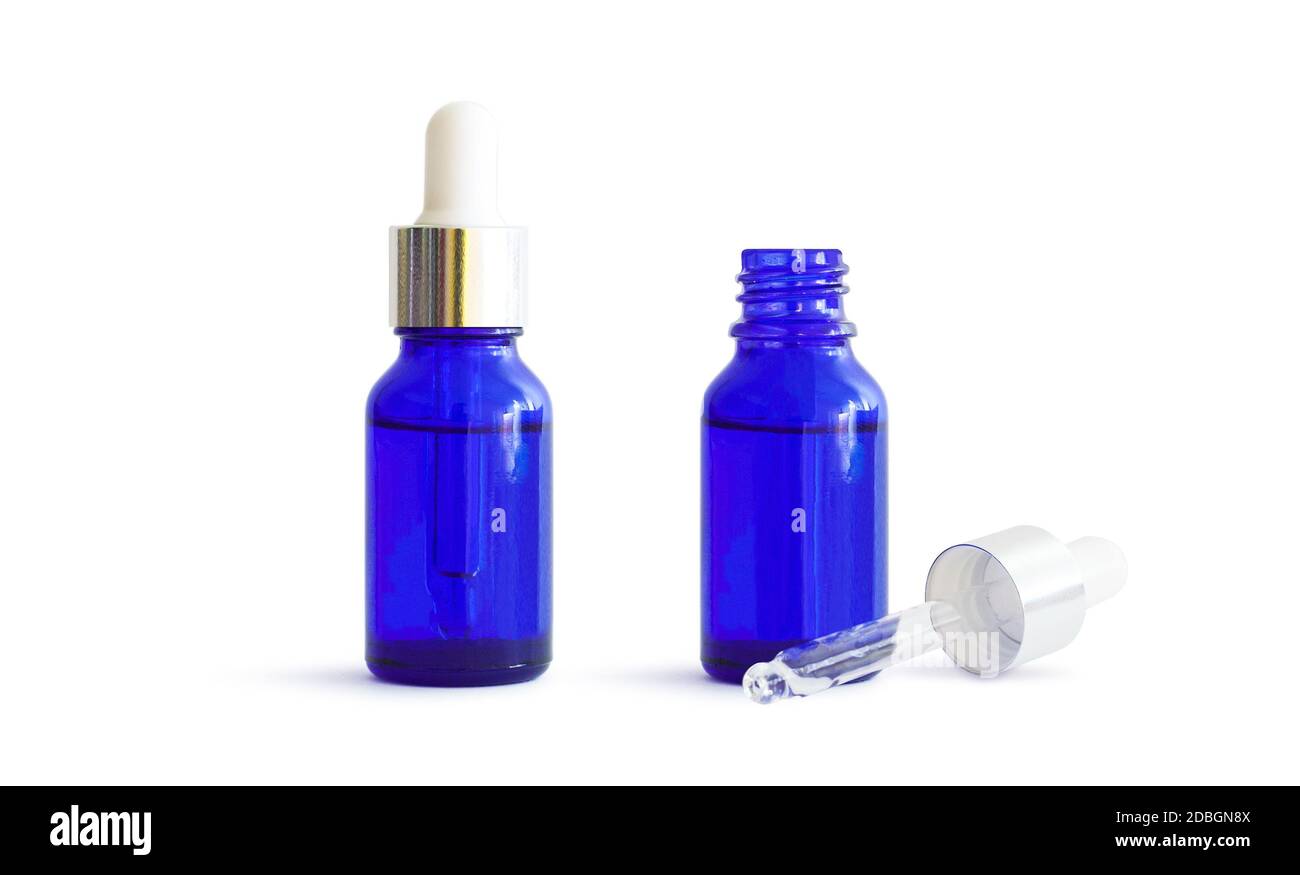 Medicine drops in bottles with a dispenser. Open and closed medicine ...