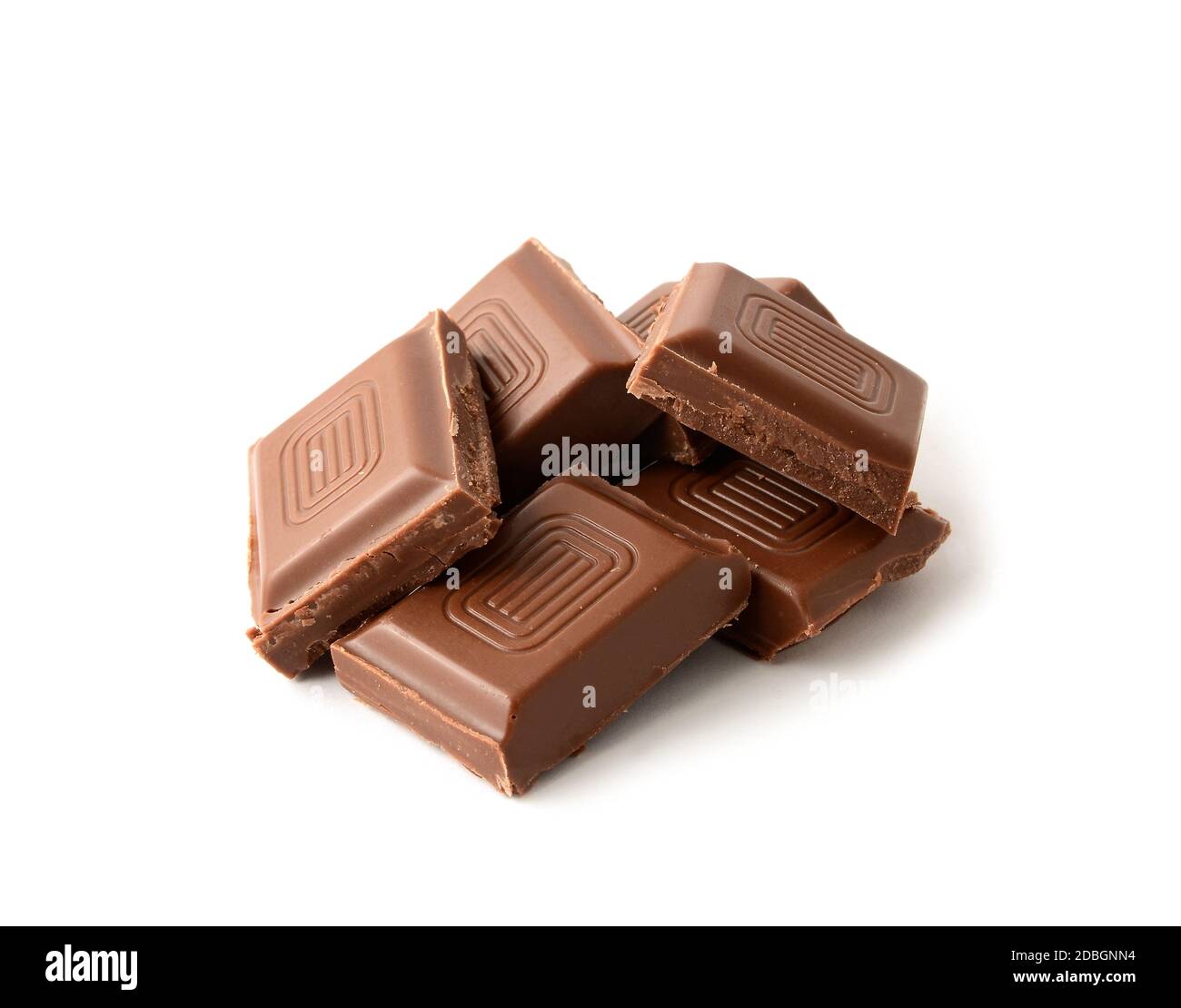 Heap of chocolate pieces over white background Stock Photo - Alamy