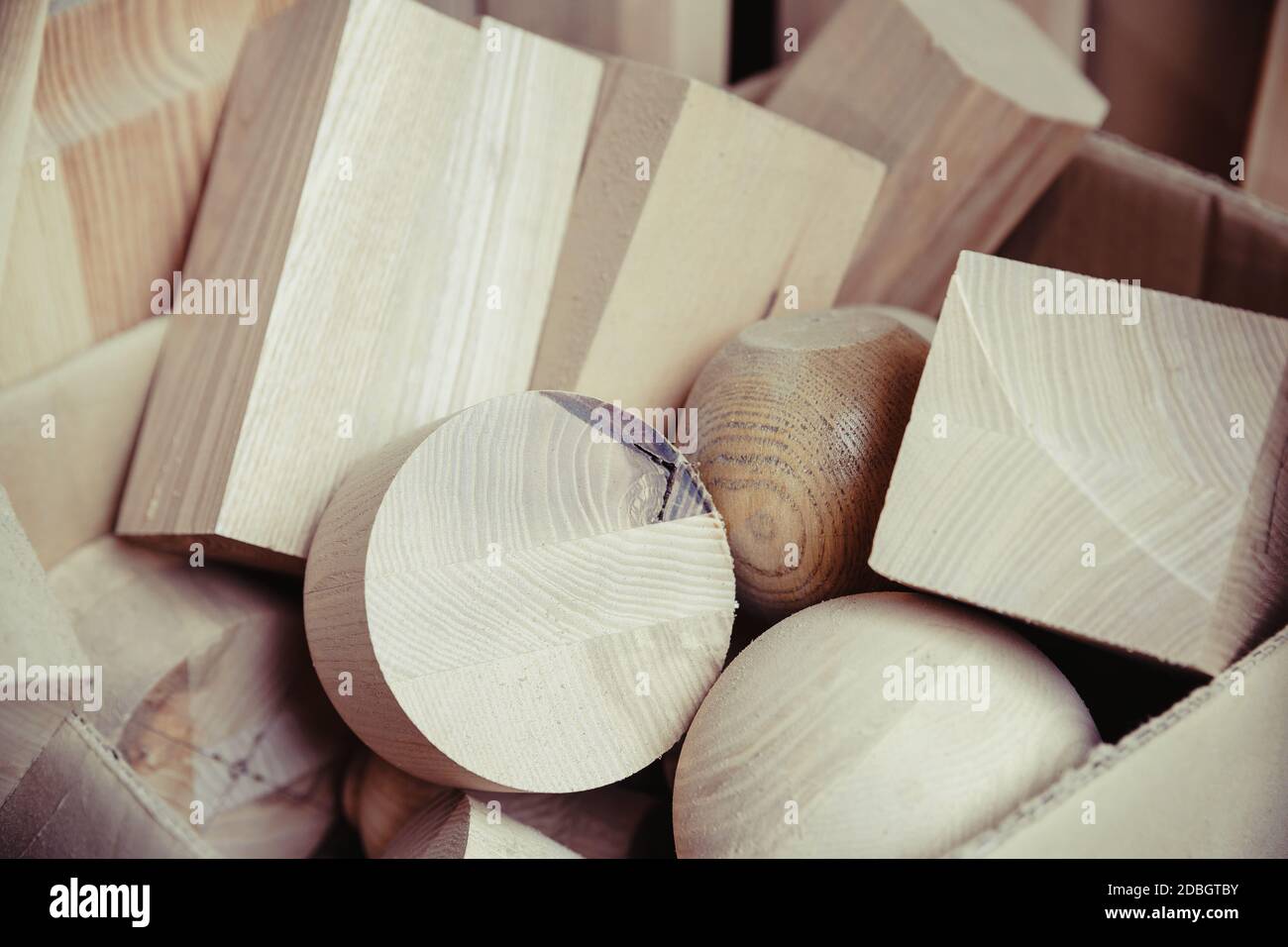 wooden geometric figures in a box Stock Photo - Alamy