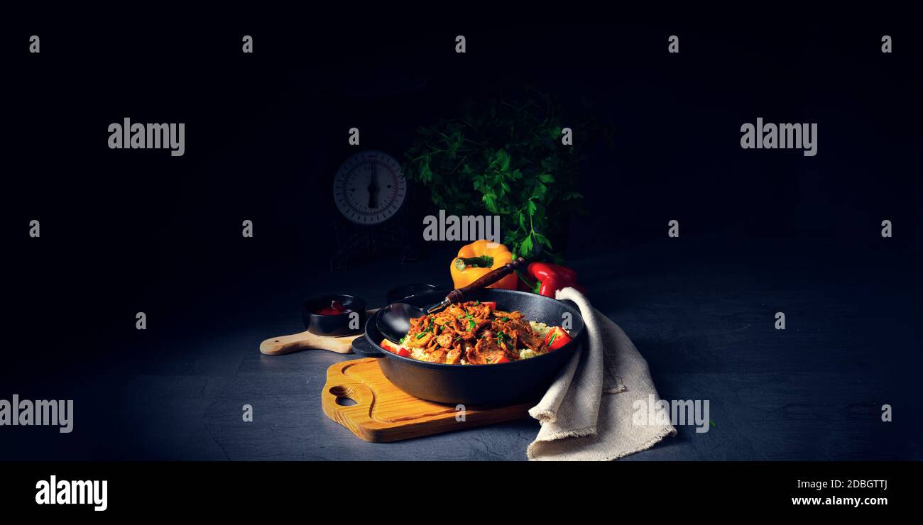 rustic bulgur pans with gratinated gyros and yoghurt Stock Photo - Alamy