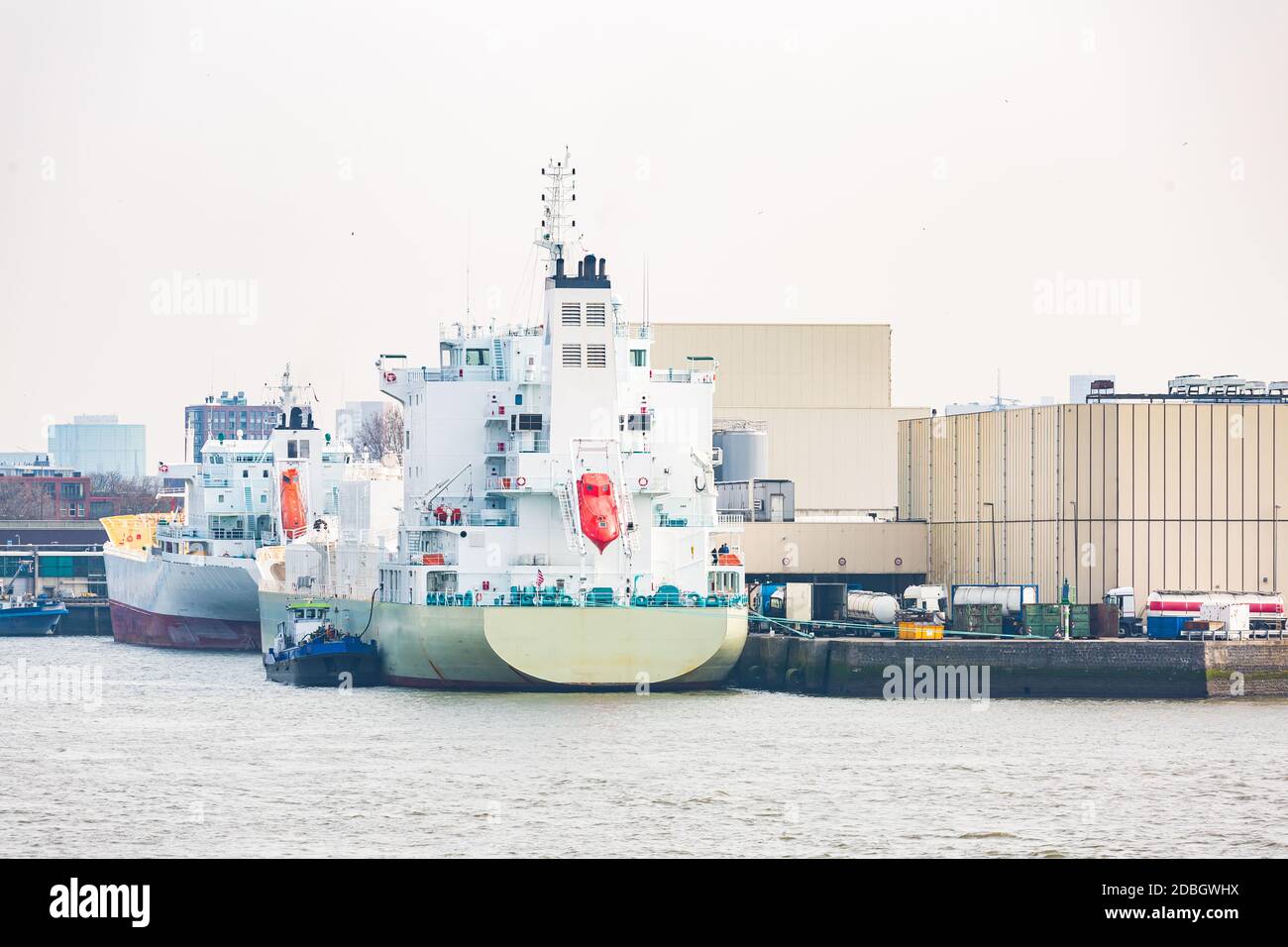 Big Cargo Containers Boat with Goods cargo Stack at the Pier docks port ...