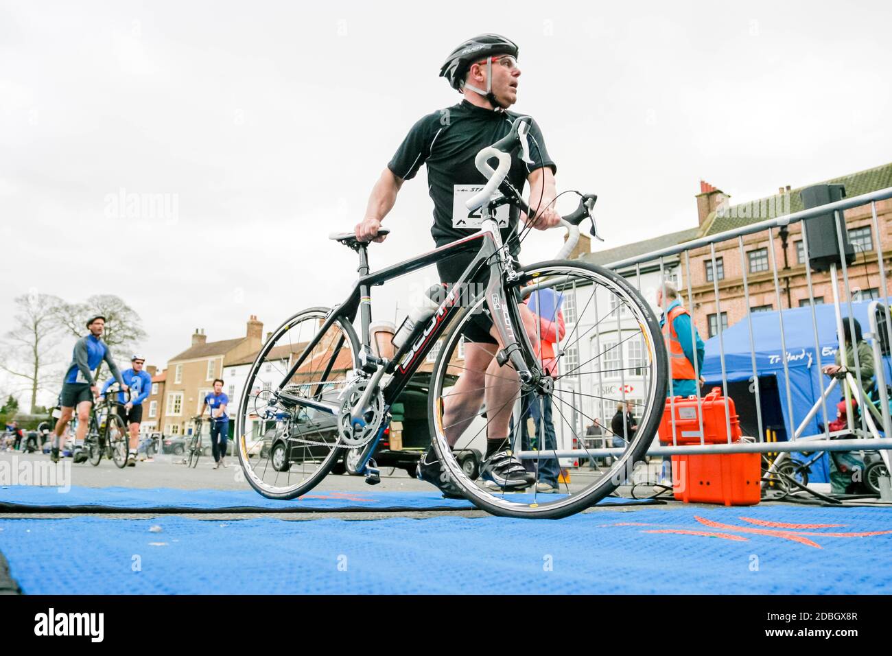 Competitors leaving the transition area for the cycle ride in the in ...