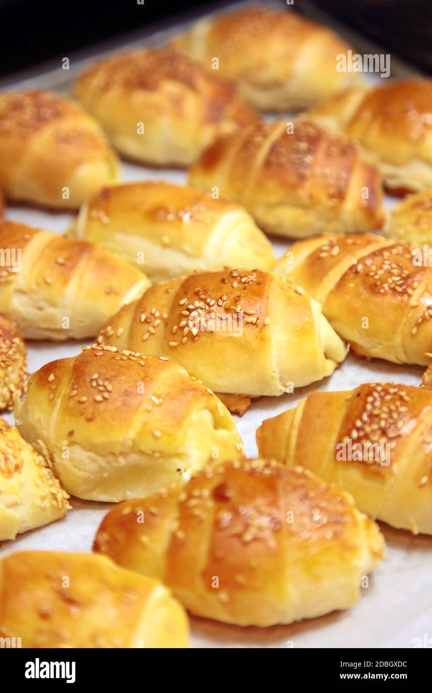 Baked rolls bread with cheese on a white background Stock Photo - Alamy