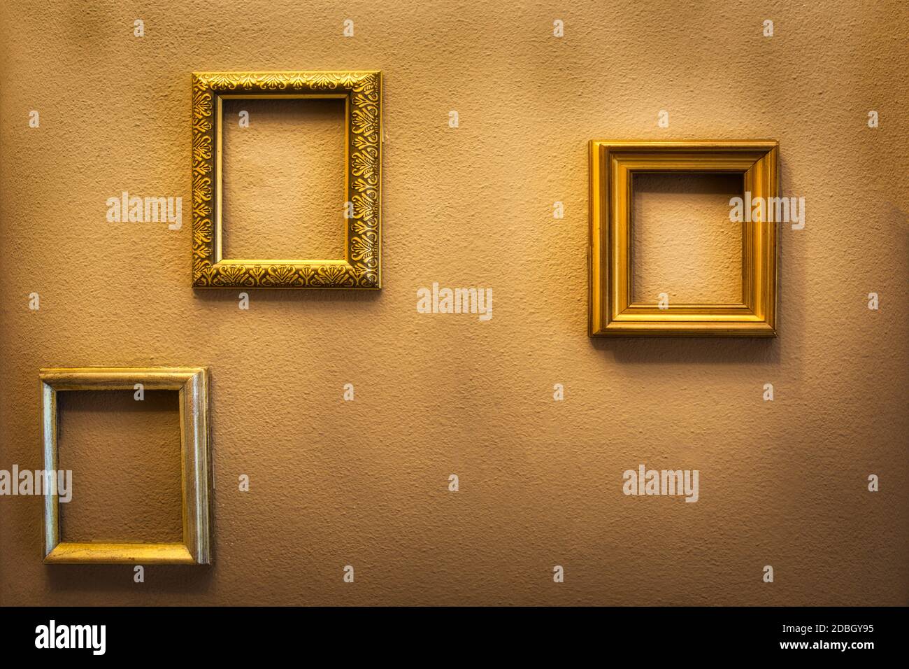 Empty golden luxury frames on vintage design wall, space for text ...
