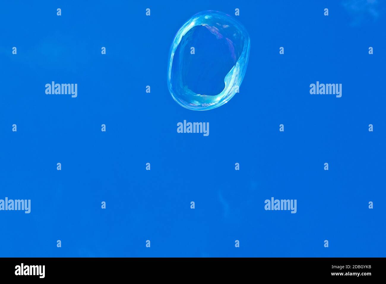Big blue bubble floating in a clear sky Stock Photo - Alamy