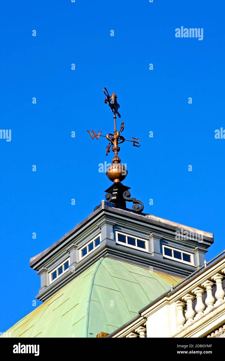 Wind wane on top of the building Stock Photo - Alamy