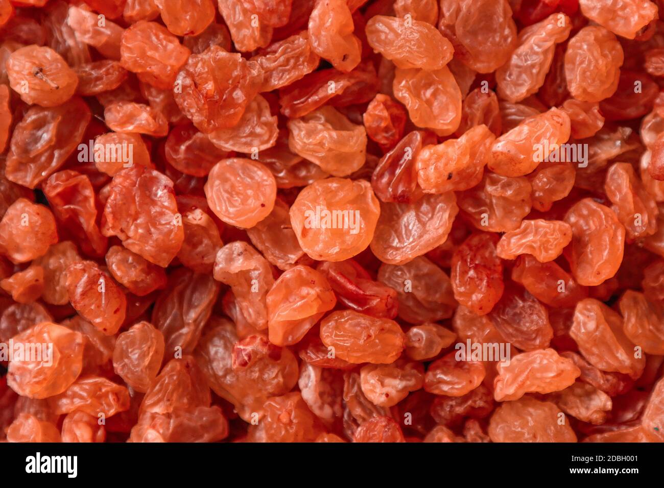 Dried red grape, raisin food background image Stock Photo - Alamy