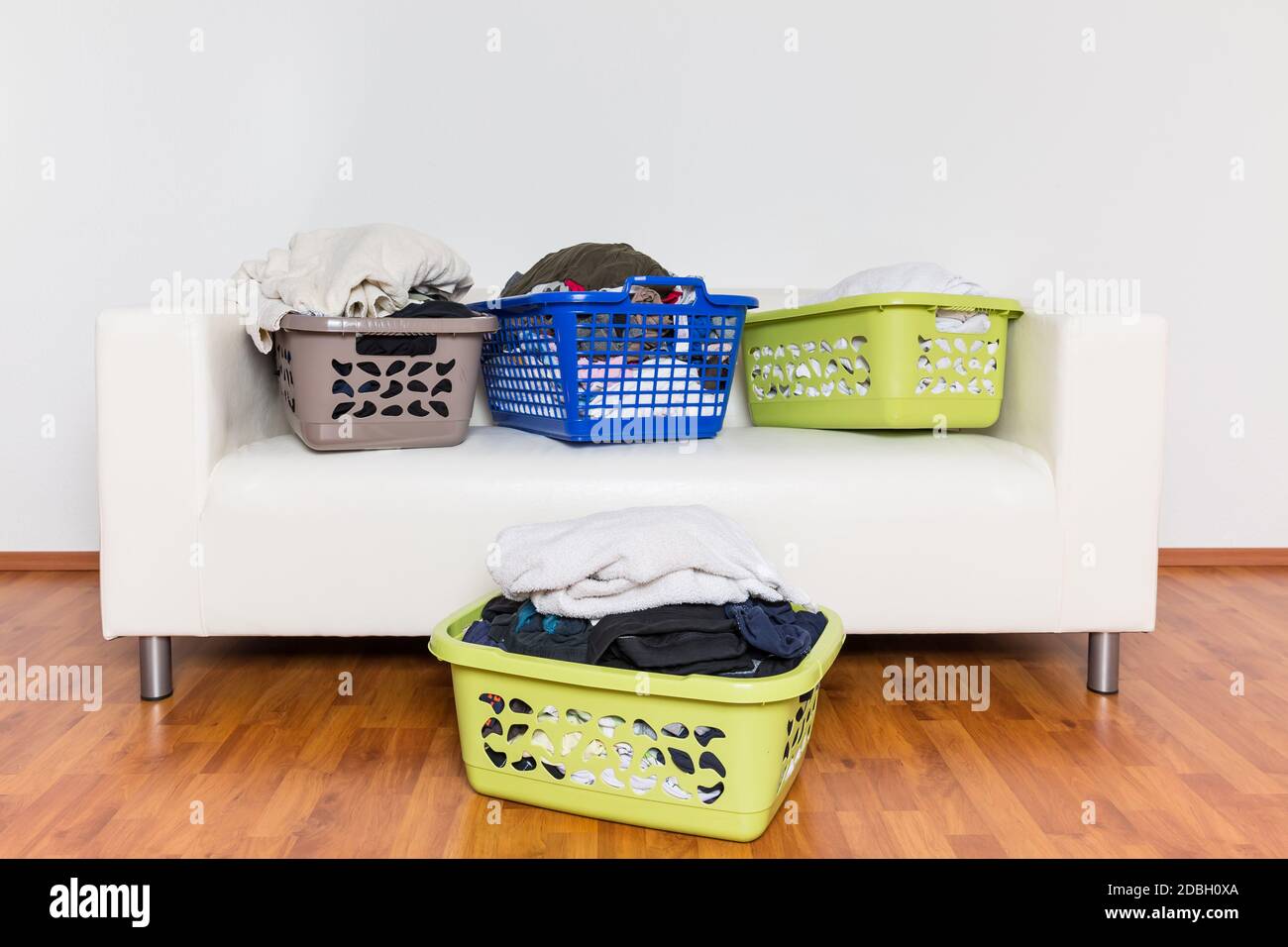 Overflowing laundry basket hi-res stock photography and images - Alamy