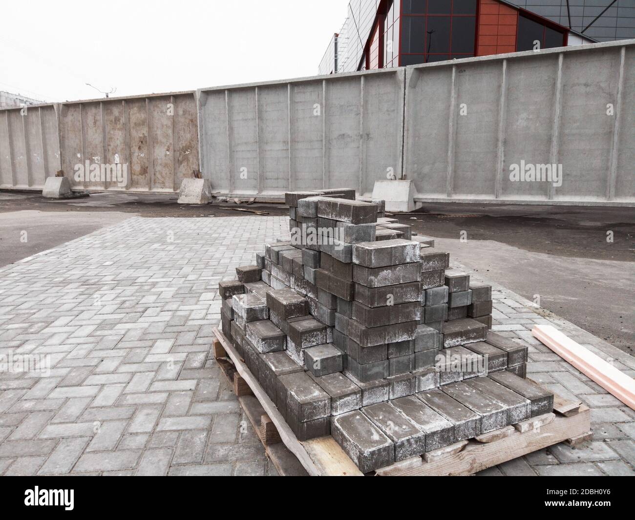 Stack of pavement stones at the road. Concept of repair of the sidewalk ...