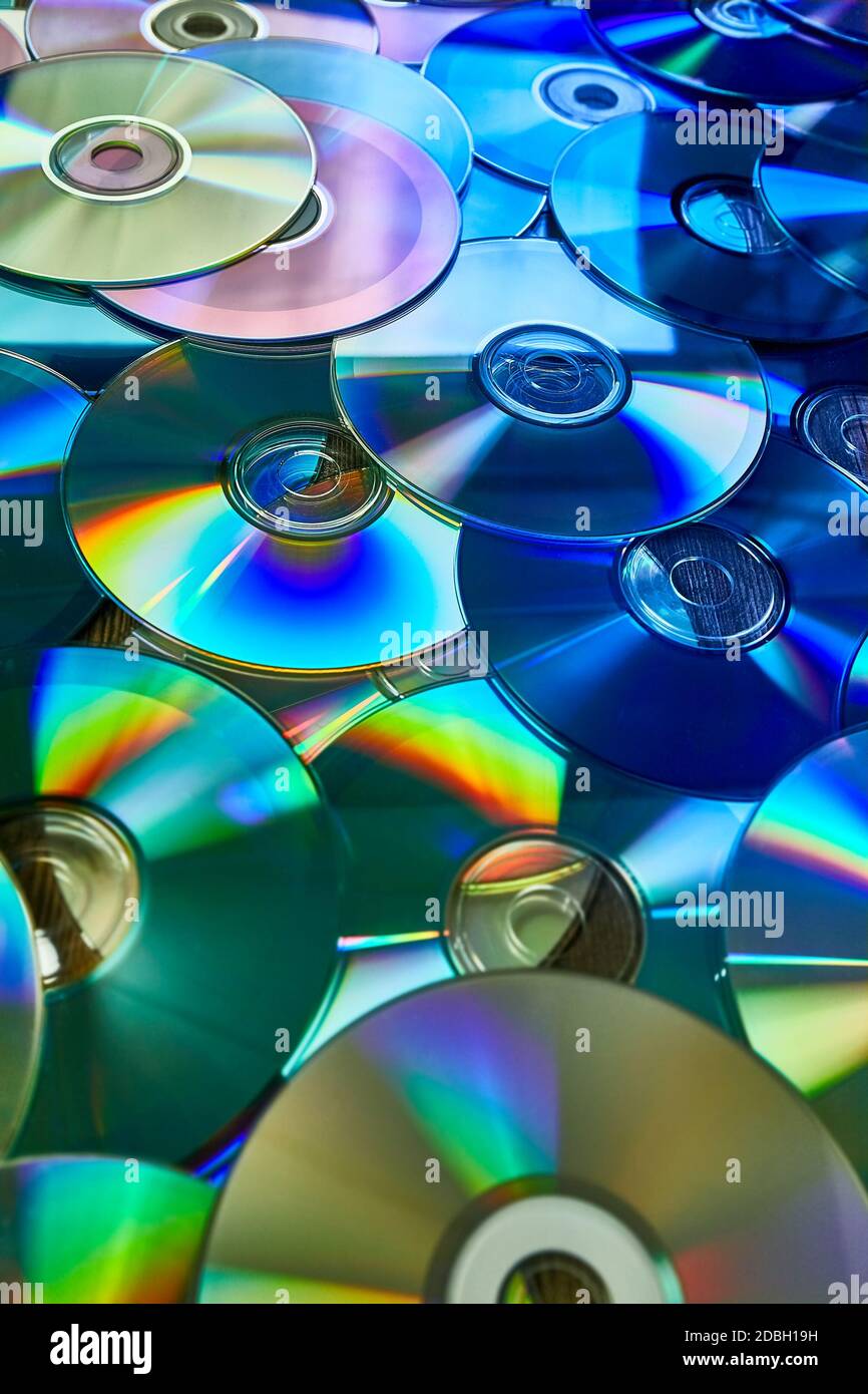 CD copmact discs in a pile making a shiny background Stock Photo - Alamy