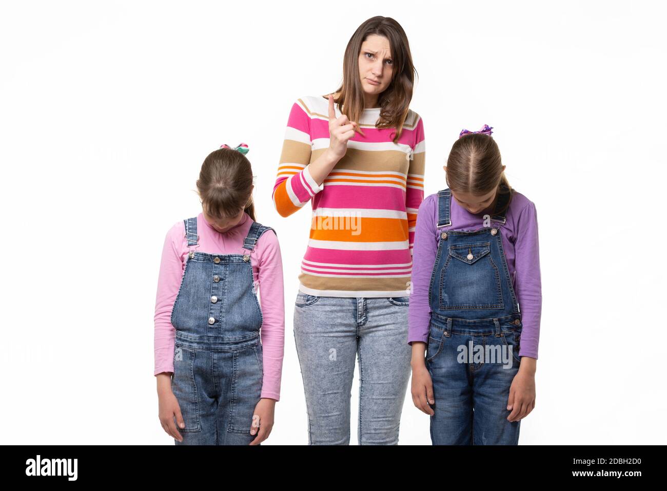 Mom scolds two guilty teenage children Stock Photo - Alamy