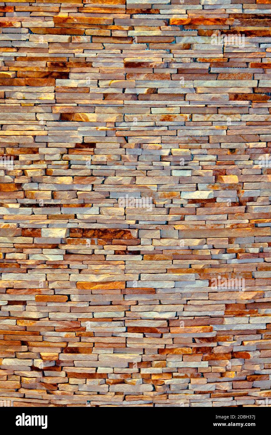 Background image of wall made of natural stone tiles Stock Photo - Alamy