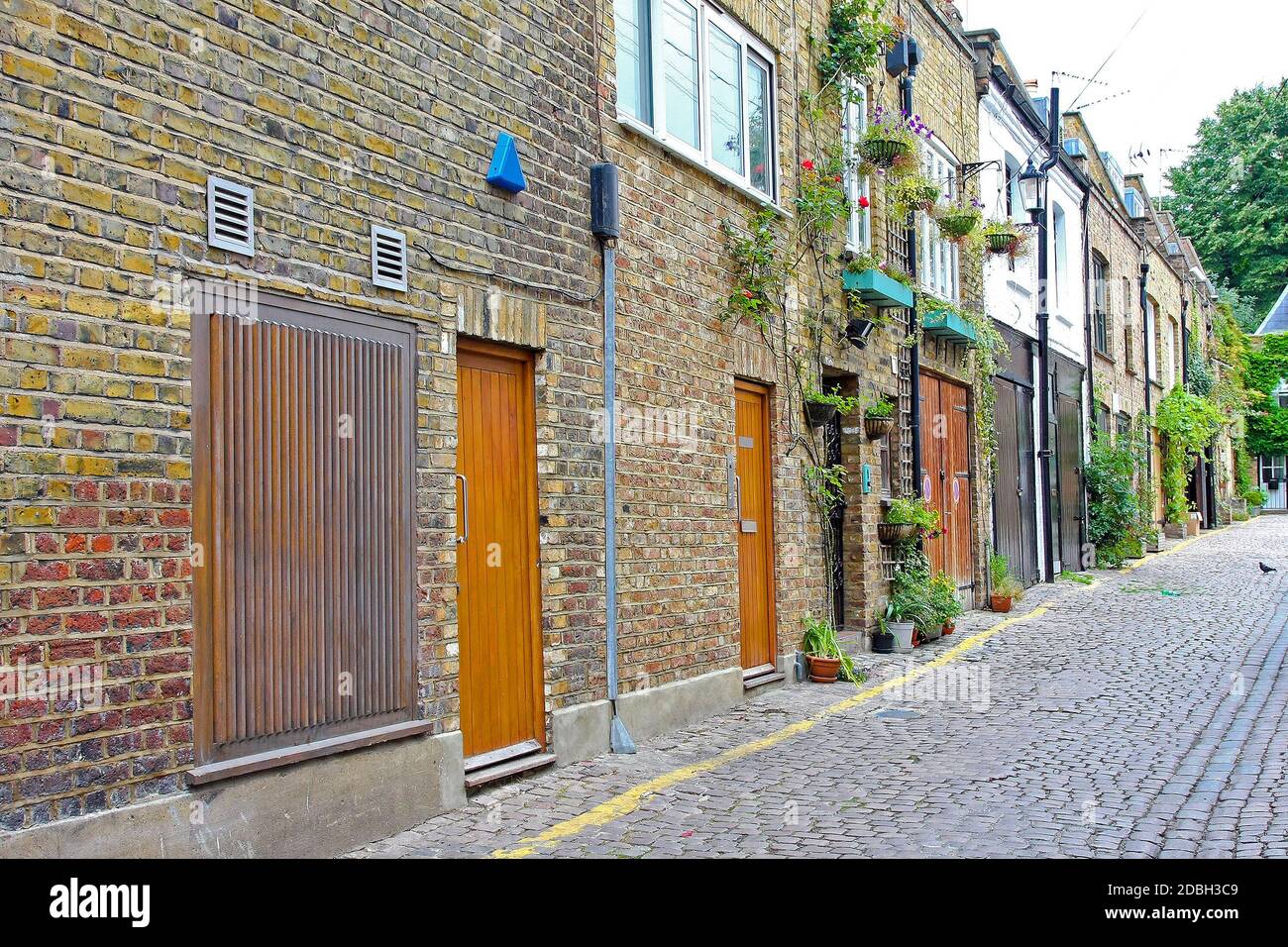 Old houses in small cobbled street in London Stock Photo - Alamy