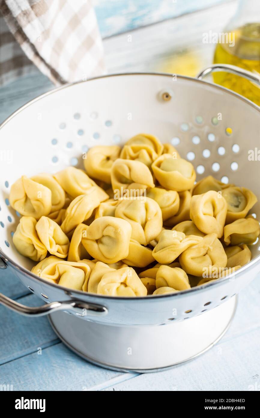 Tortellini pasta. Italian stuffed pasta in colander Stock Photo - Alamy