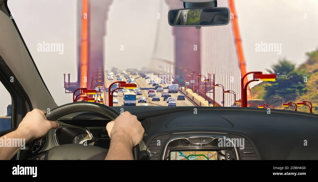 Driving a car towards the traffic on the Golden Gate Bridge in San ...