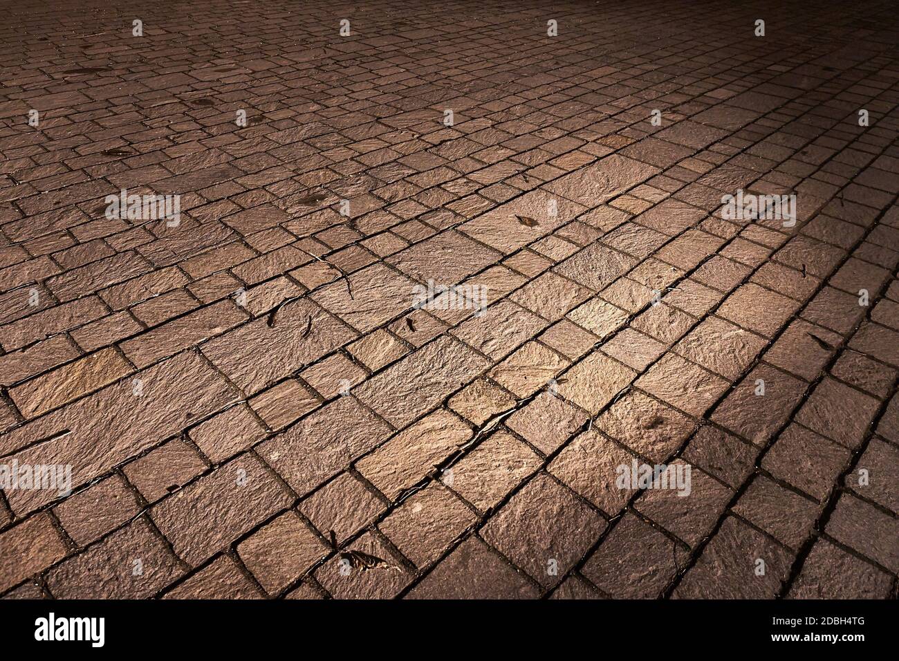Dark pavement made of old stones in the dark of night Stock Photo - Alamy