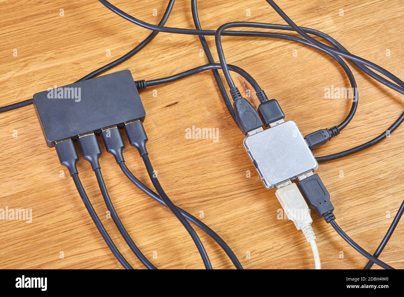 USB hubs connected to each other with many cables and devices Stock ...