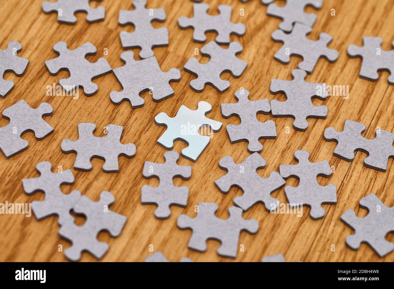 Jigsaw puzzle pieces scatteres around on the floor Stock Photo - Alamy