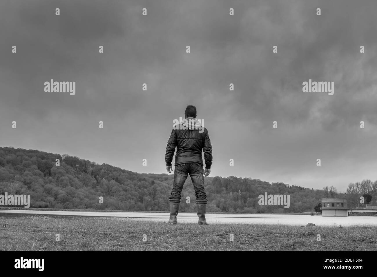 One man standing from behind Black and White Stock Photos & Images - Alamy