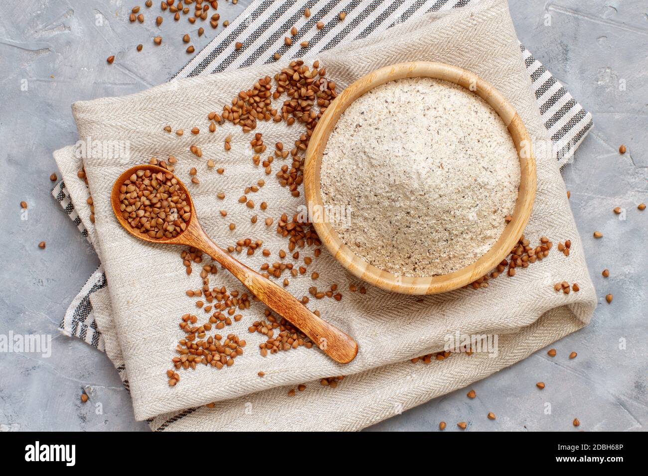 Buckwheat flour in a bowl and buckwheat grain in a spoon top view Stock ...