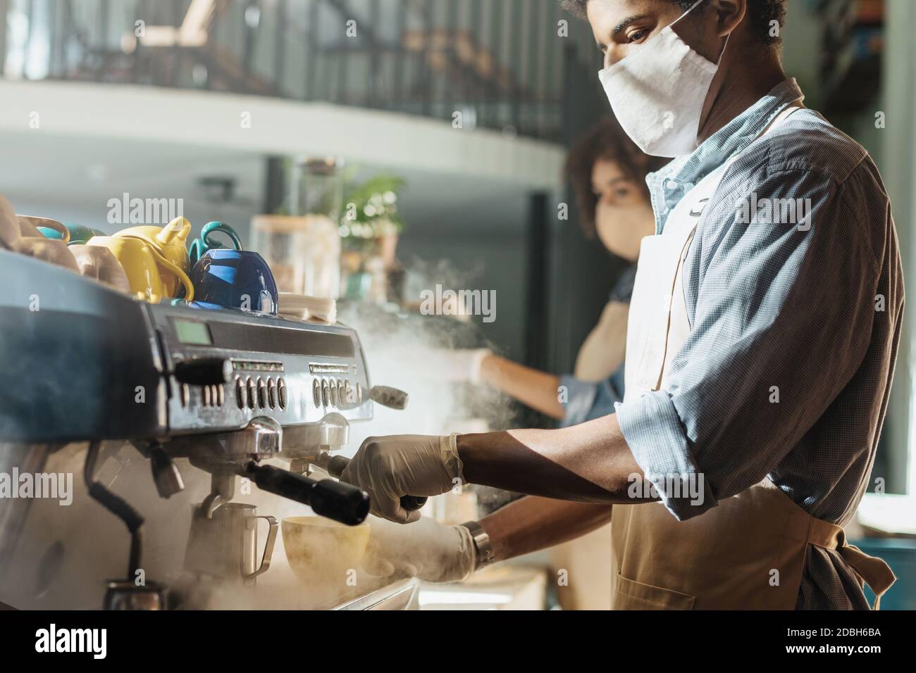 Modern barista work with equipment during social distancing Stock Photo ...