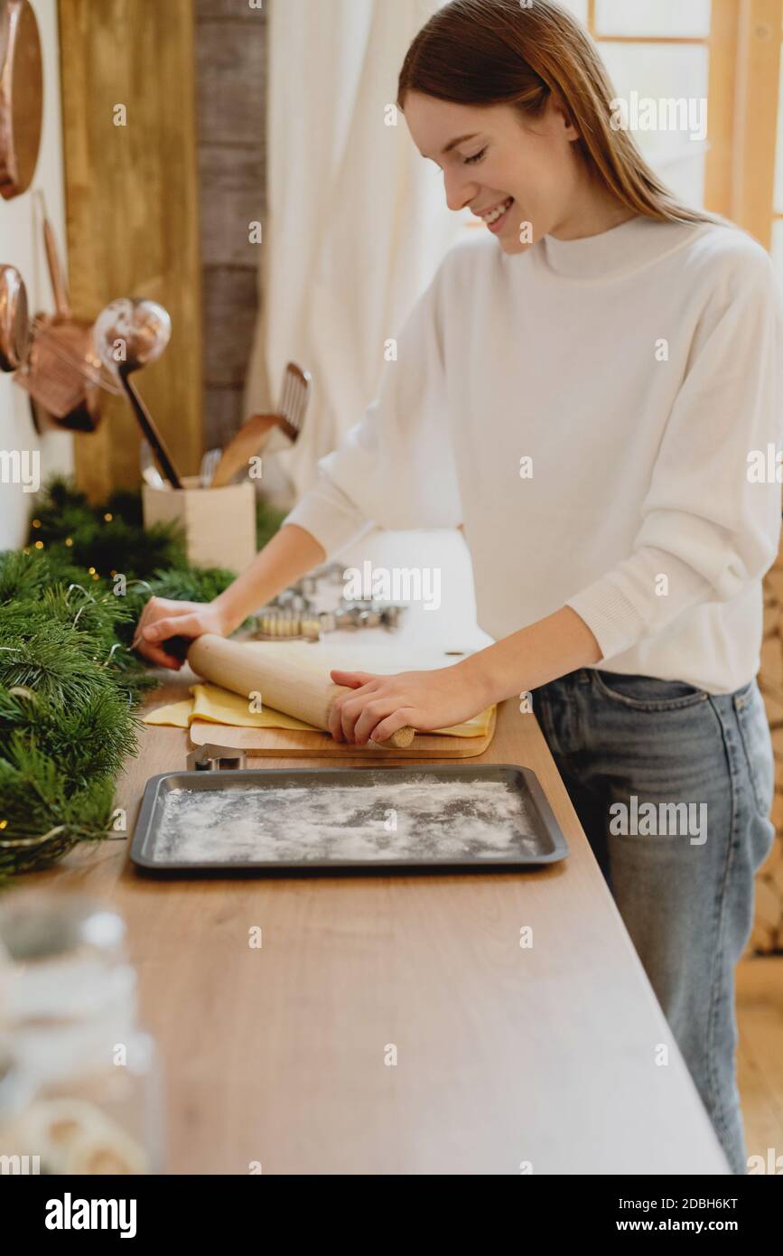 Beautiful smiling woman baking Christmas cookies in her kitchen Stock ...
