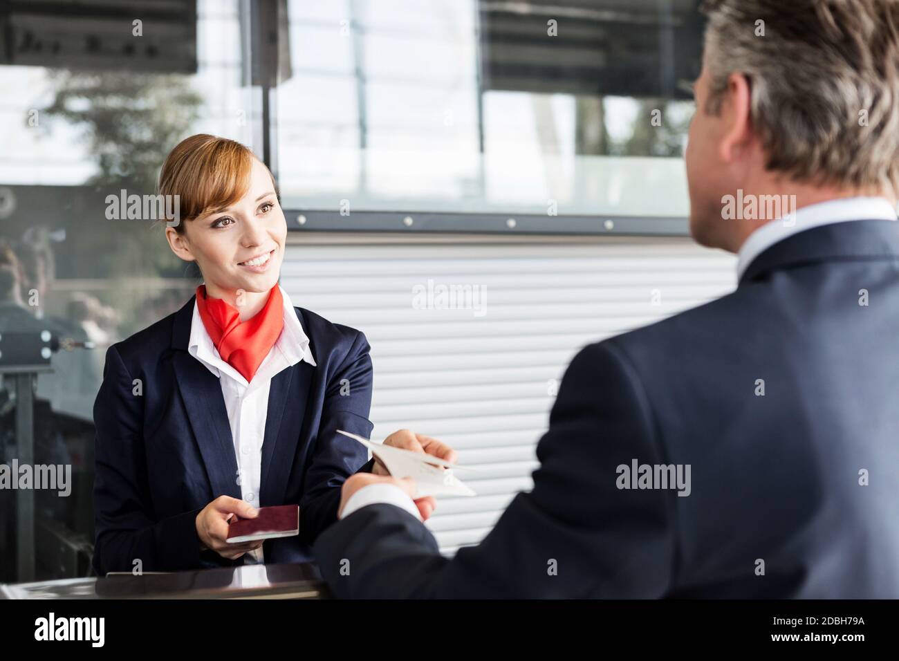 Agent checking passport hi-res stock photography and images - Alamy